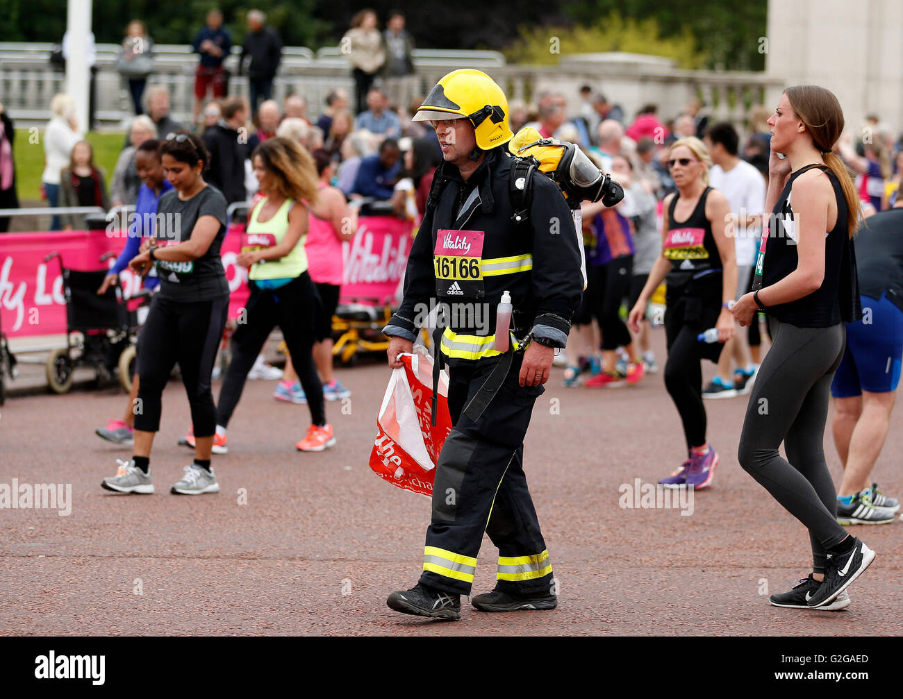 General view of runner dressed in a fireman outfit at the finish of the ...