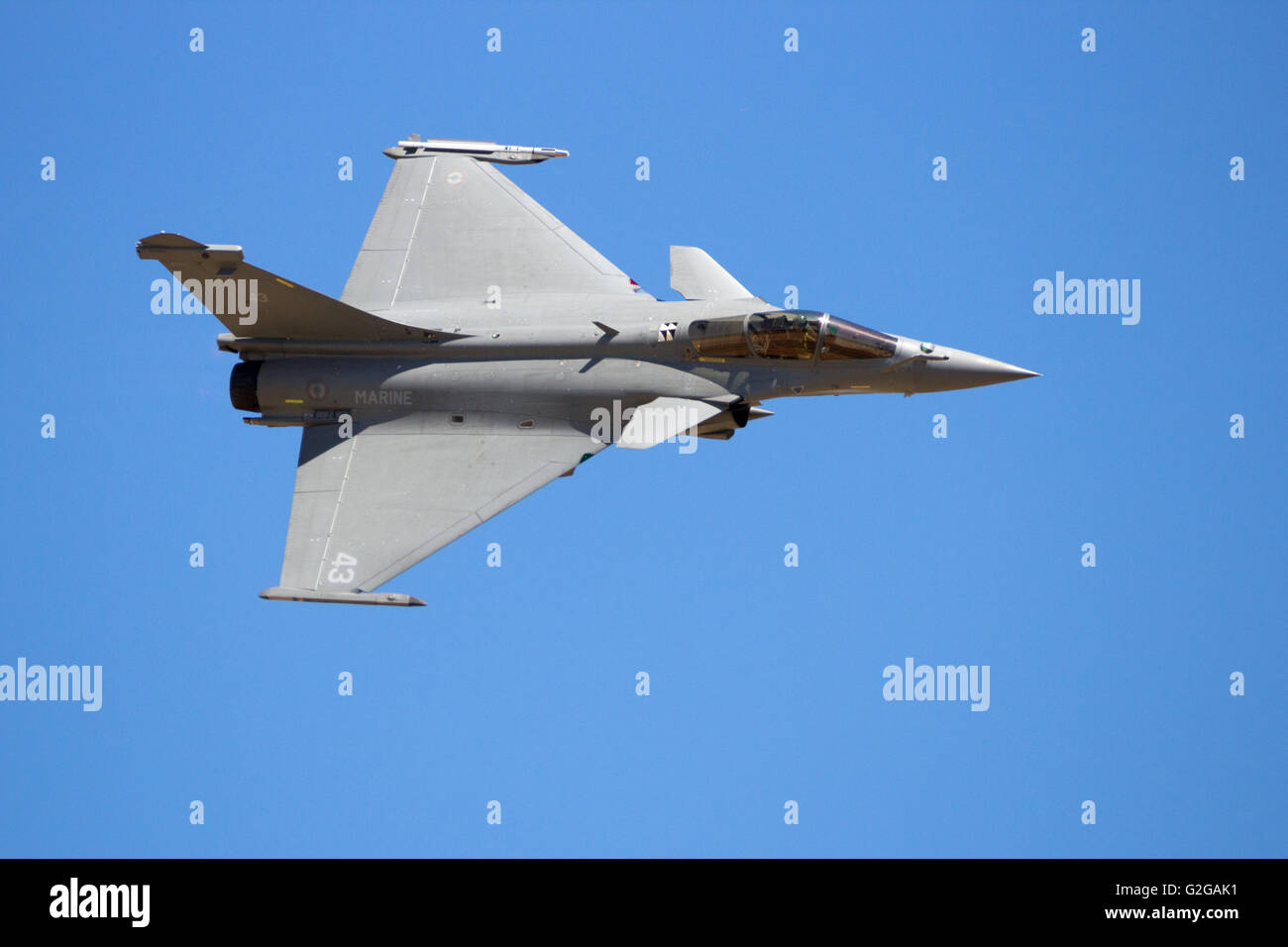 French Navy Dassault Rafale fighter jet flyby on a blue sky Stock Photo ...