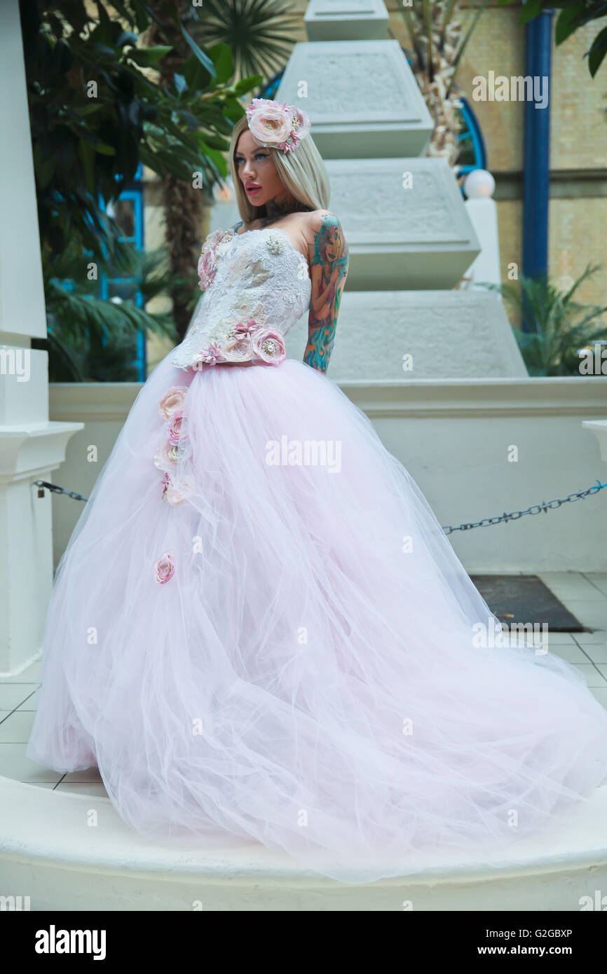 Becky Holt showcasing tattoos and wedding dress by Philippa Lusty at ...