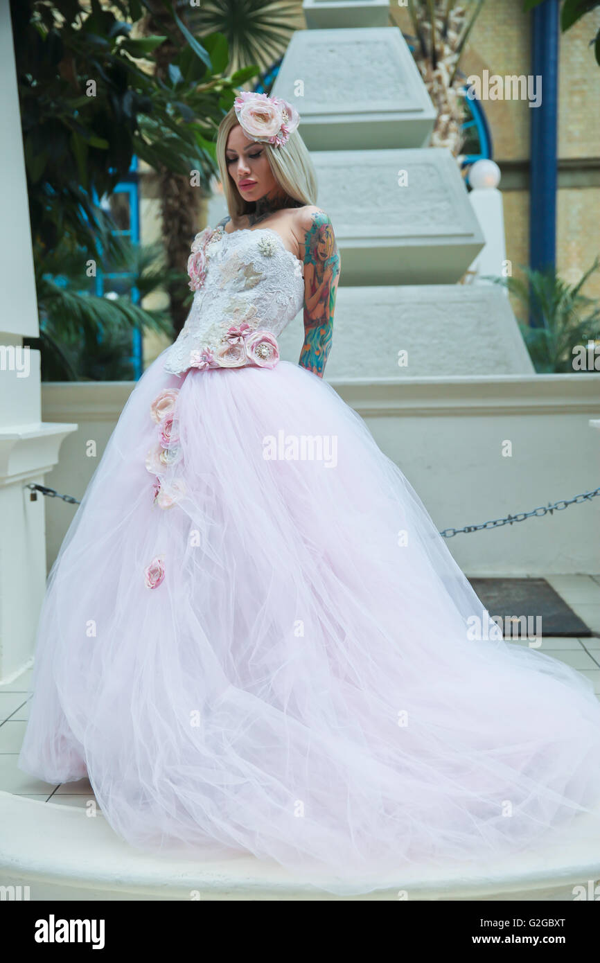 Becky Holt showcasing tattoos and wedding dress by Philippa Lusty at ...