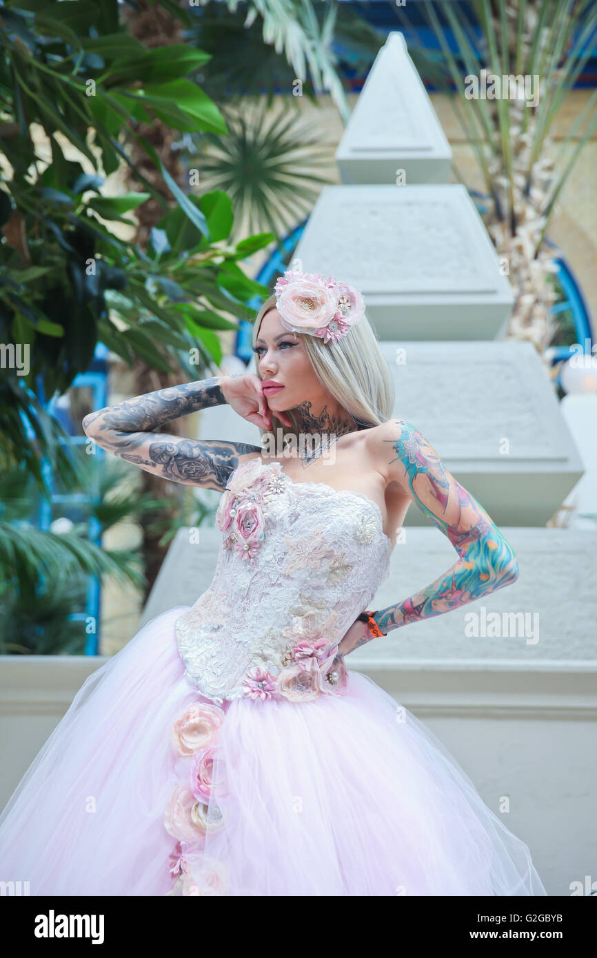 Becky Holt showcasing tattoos and wedding dress by Philippa Lusty at ...