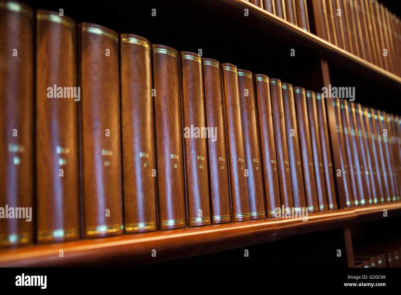 Book shelf in a church library full with brown books Stock Photo - Alamy