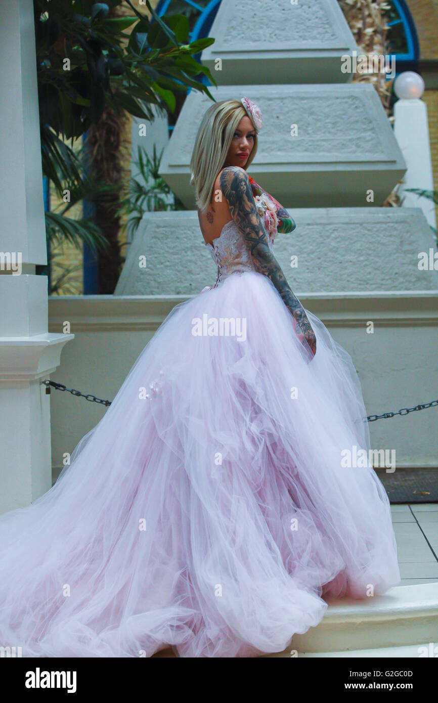 Becky Holt showcasing tattoos and wedding dress by Philippa Lusty at ...