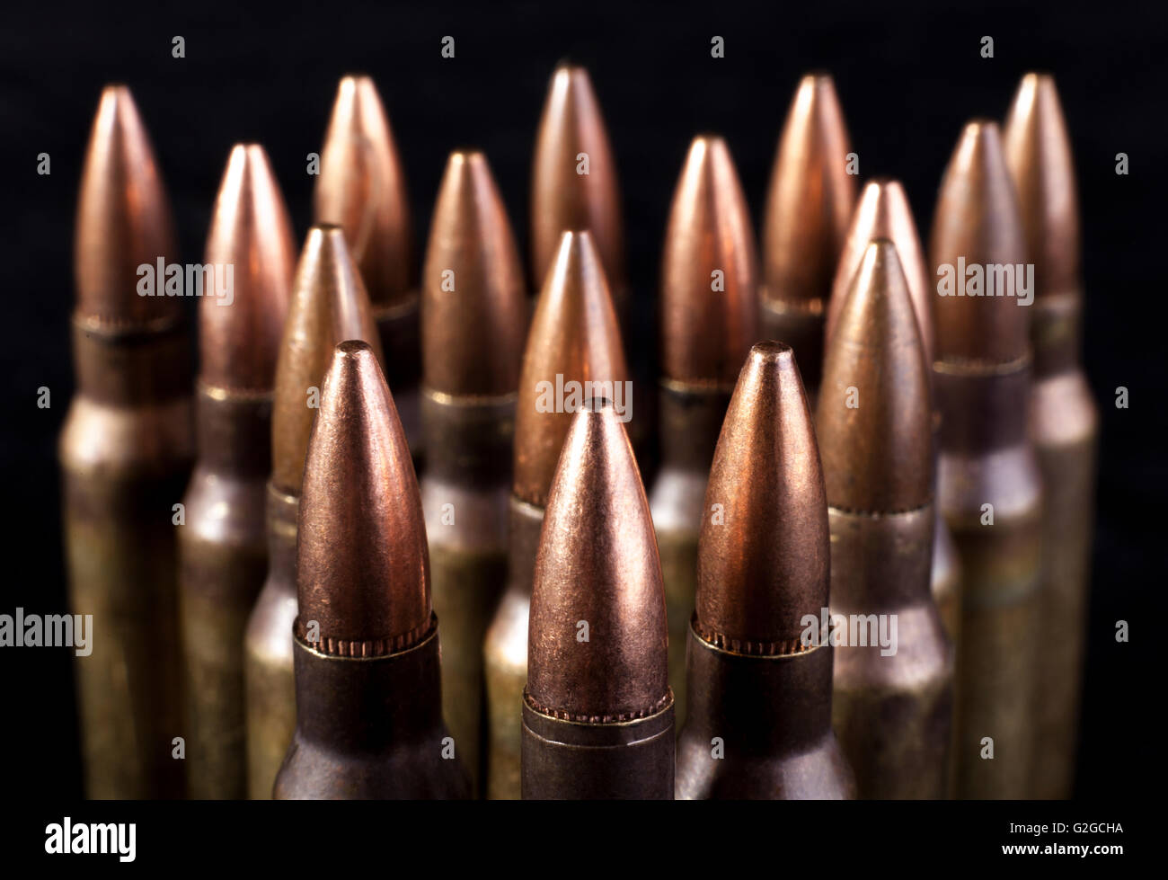 Bullets closeup on black backgrounds Stock Photo - Alamy