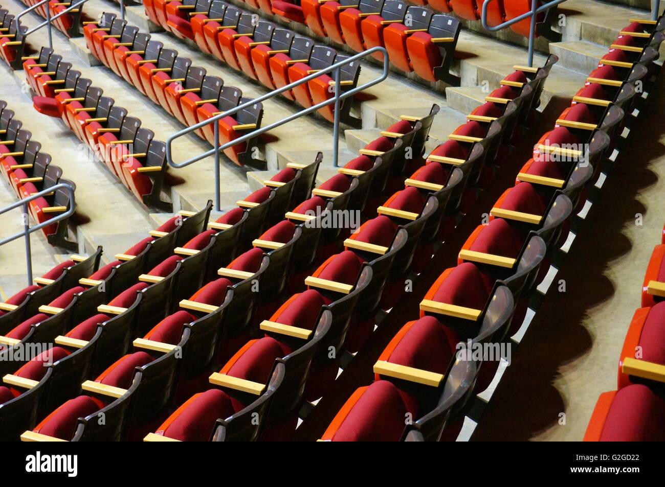Folded red seats at a multipurpose arena and sports stadium Stock Photo ...
