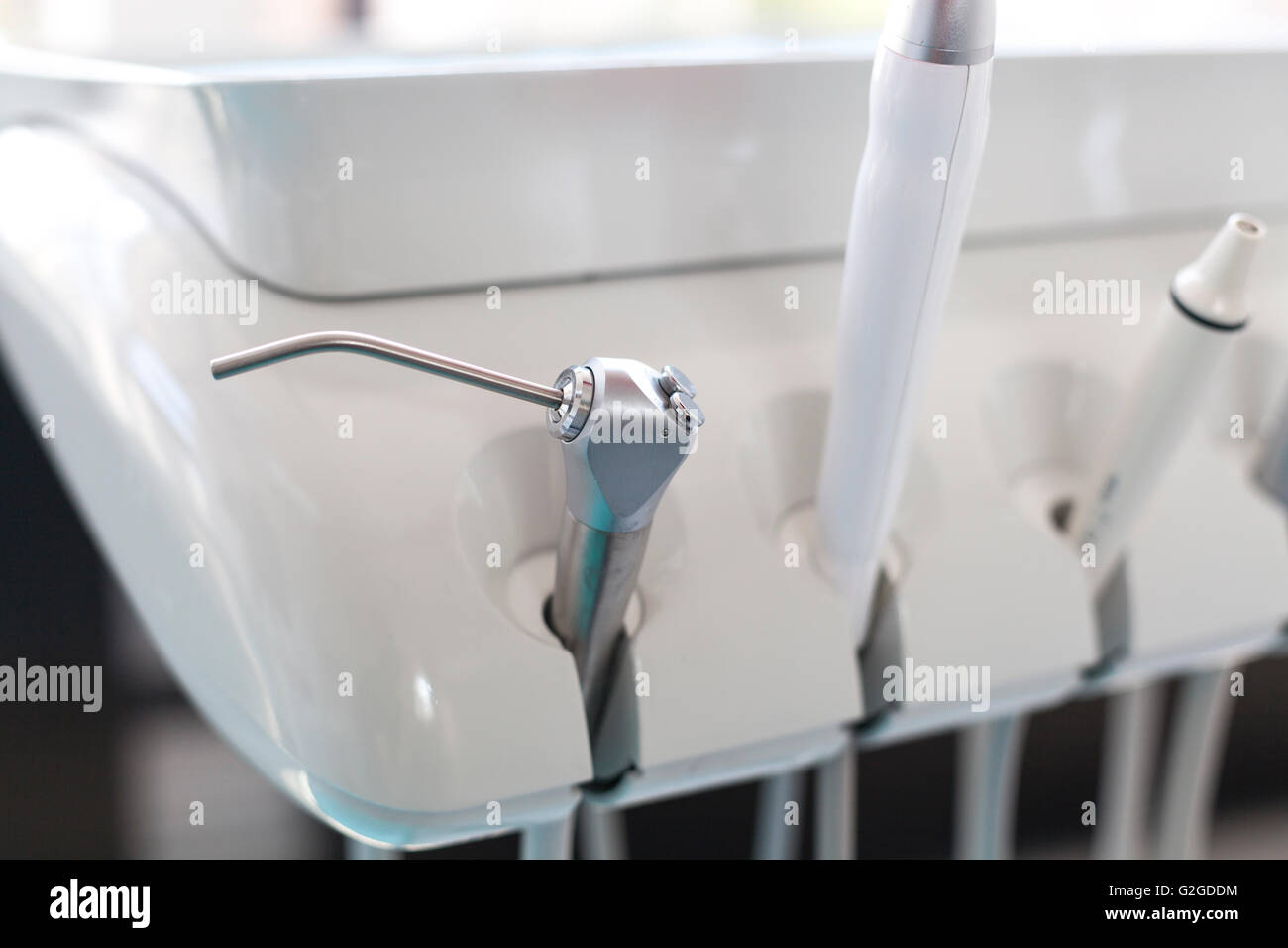 Dentist chair tools closeup on the dryer Stock Photo - Alamy