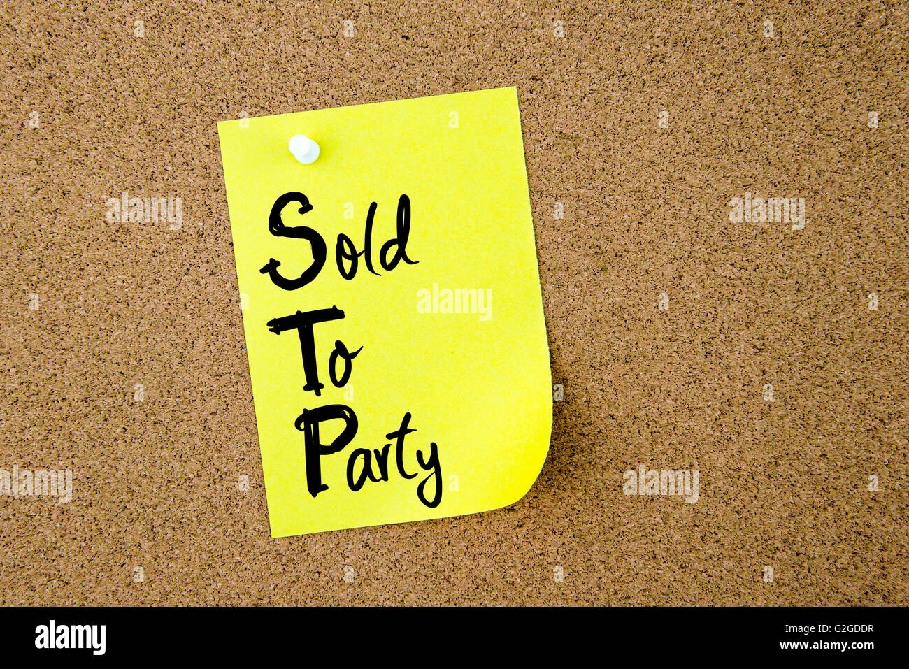 Business Acronym STP Sold To Party written on yellow paper note pinned ...