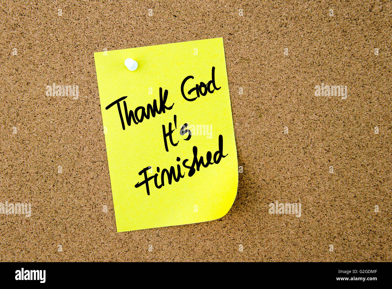 Thank God It Is Finished written on yellow paper note pinned on cork ...