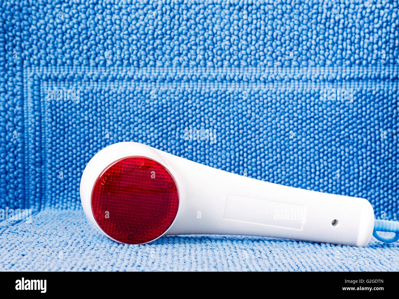 Infrared hand held massager turned off Stock Photo - Alamy