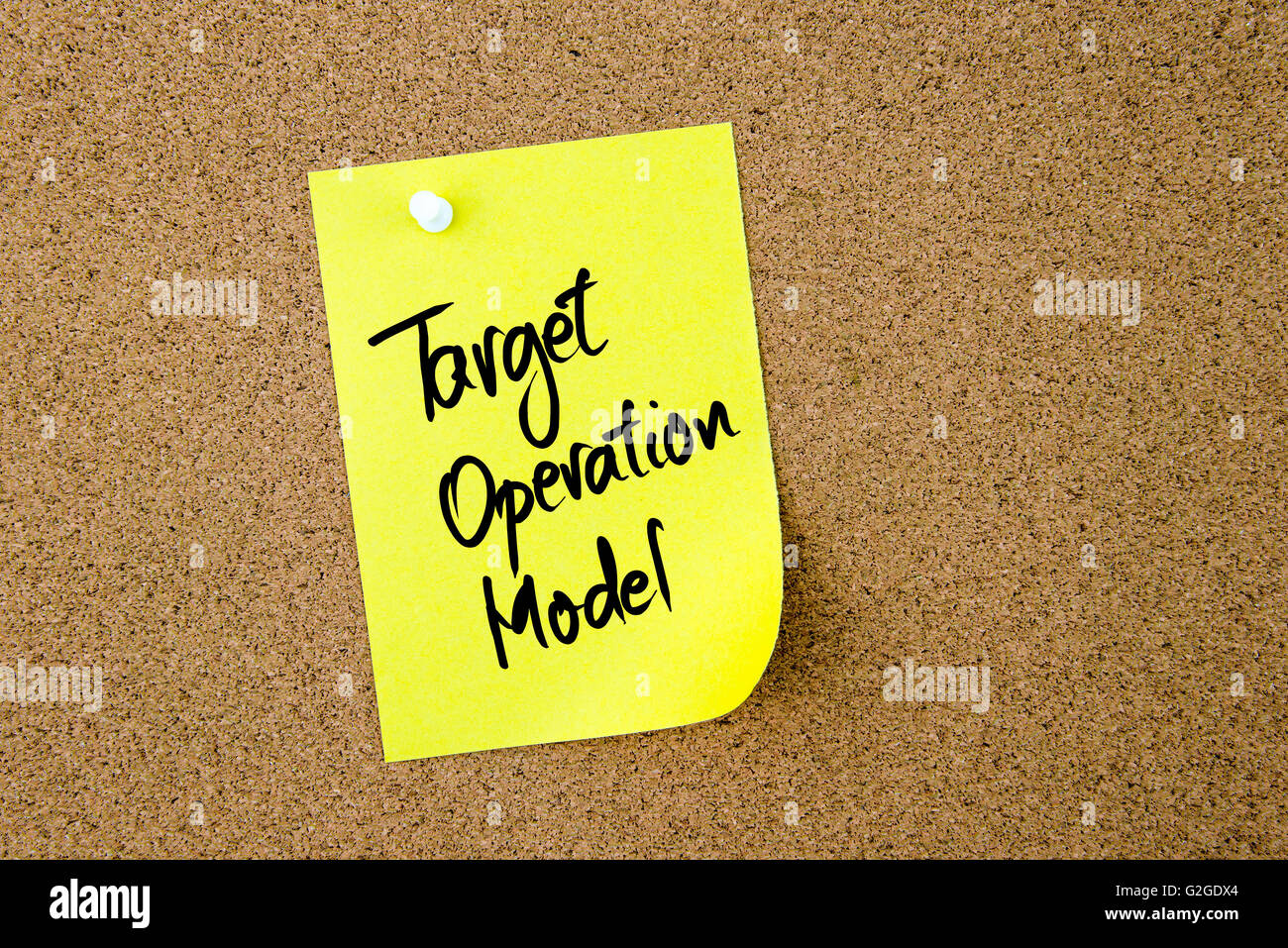 Target Operation Model written on yellow paper note pinned on cork ...