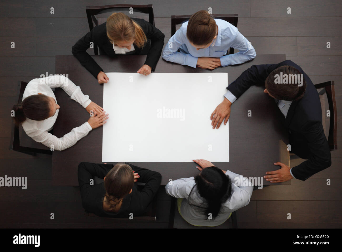 Group of business people with blank paper, new project concept Stock ...