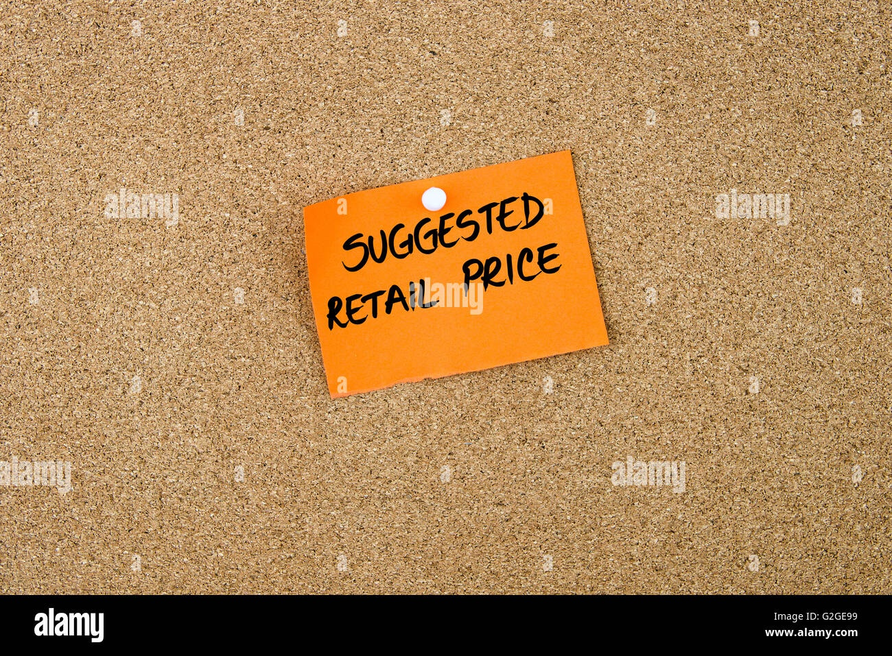 SUGGESTED RETAIL PRICE written on orange paper note pinned on cork ...