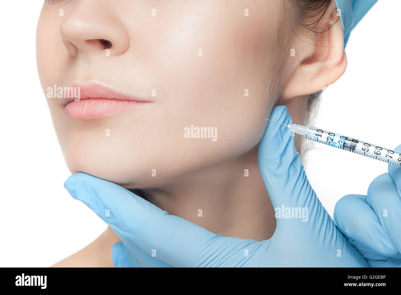 Attractive woman at plastic surgery with syringe in her face Stock ...