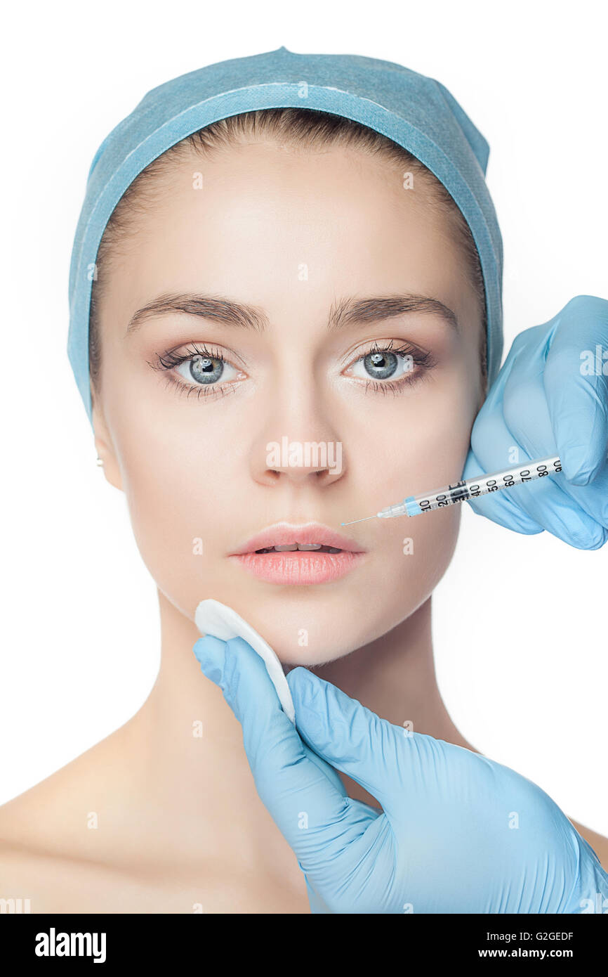 Attractive woman at plastic surgery with syringe in her face Stock ...