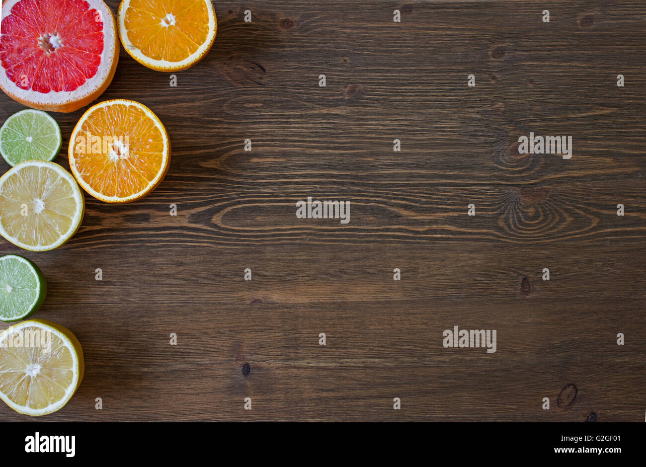 Citrus fruits. Over wood table background Stock Photo - Alamy