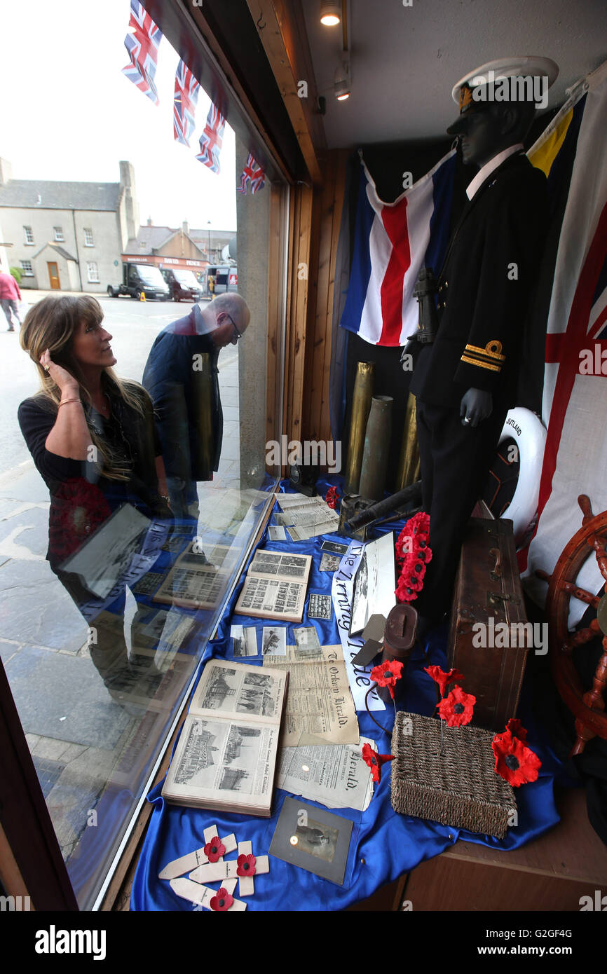 Shop owner Lynn Laughton views her window display in Kirkwall, Orkney ...