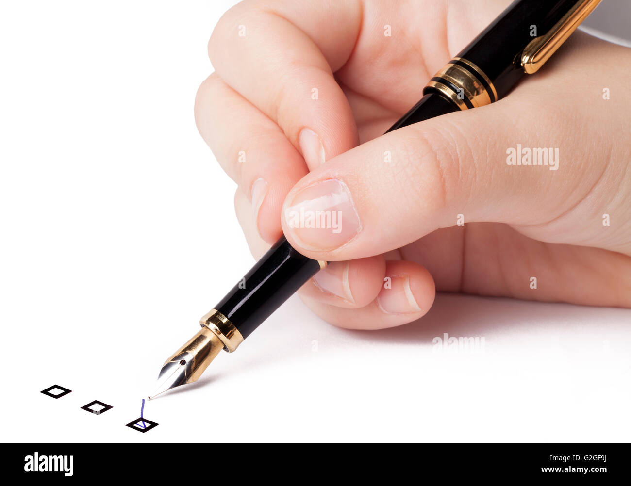 Choosing lower check-box in survey with hand and blue fountain pen ...