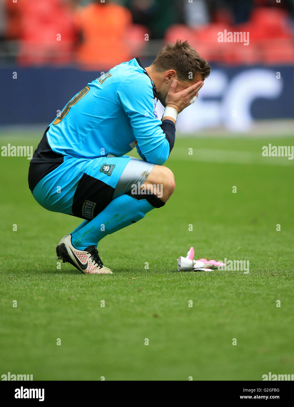 Plymouth Argyle goalkeeper Luke Mccormick sits dejected after the Sky ...