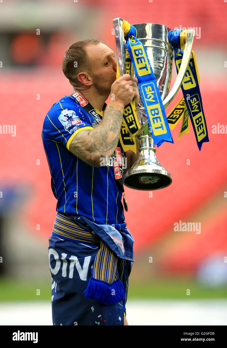 AFC Wimbledon's Barry Fuller kisses the trophy after winning the Sky ...
