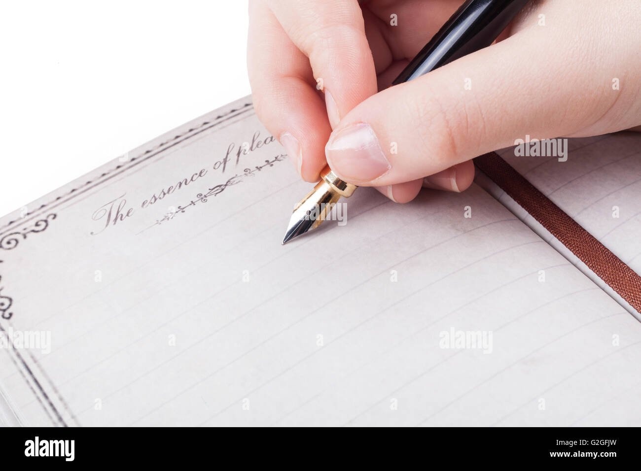 Female hand writing empty page in diary with fountain pen Stock Photo ...