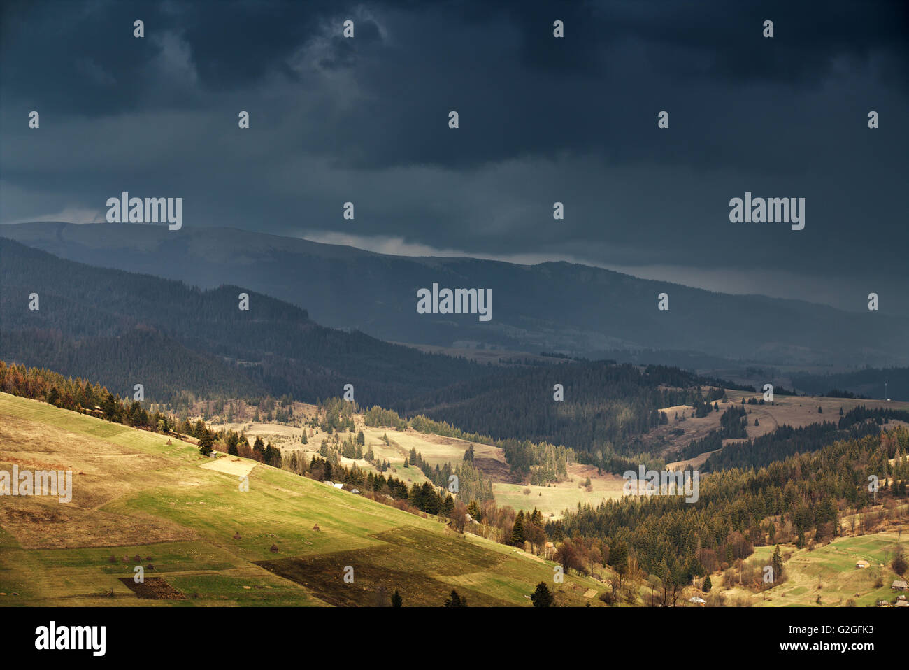 Spring rain in mountains. Thunder and clouds Stock Photo - Alamy