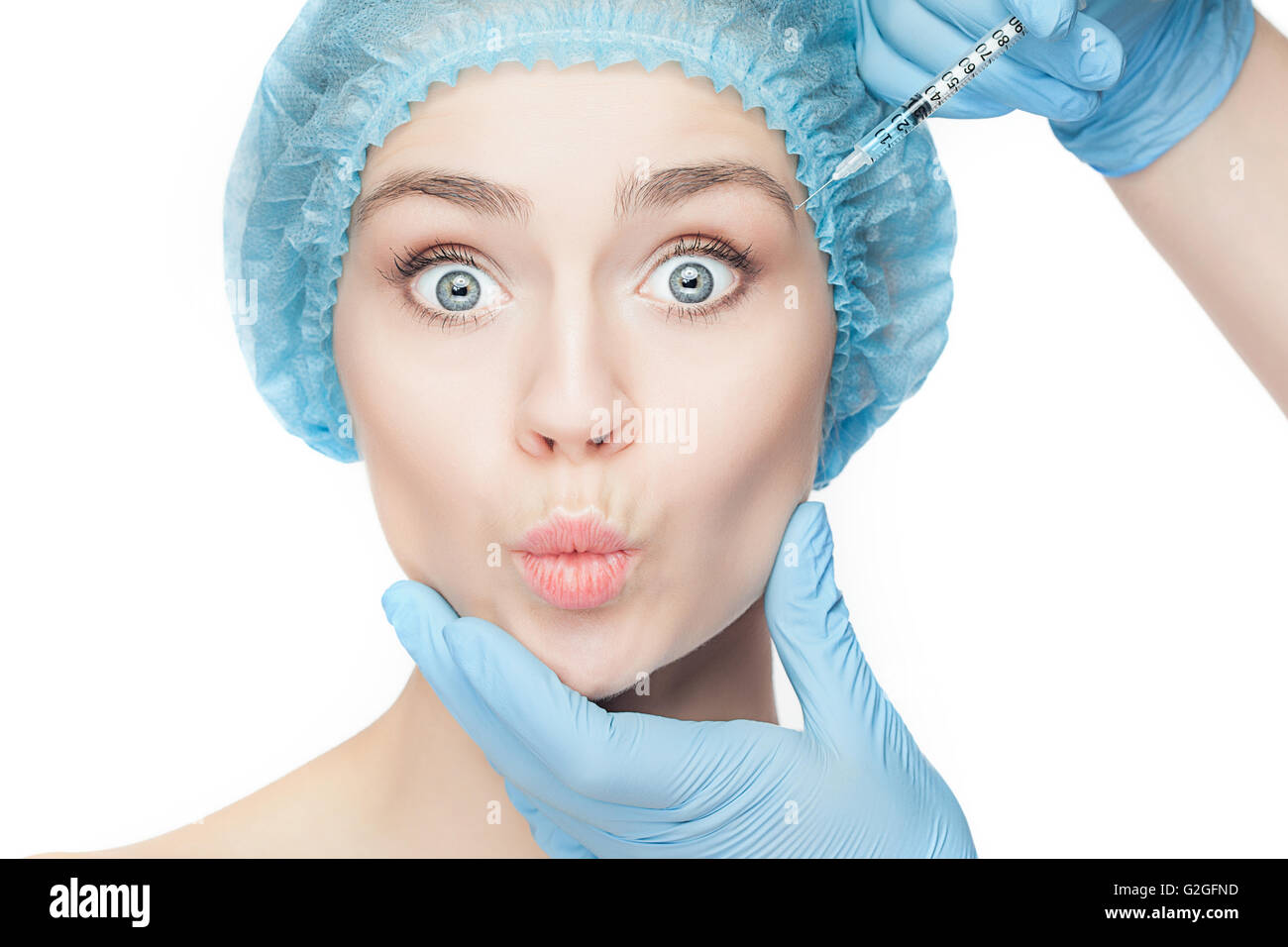 Attractive woman at plastic surgery with syringe in her face Stock ...