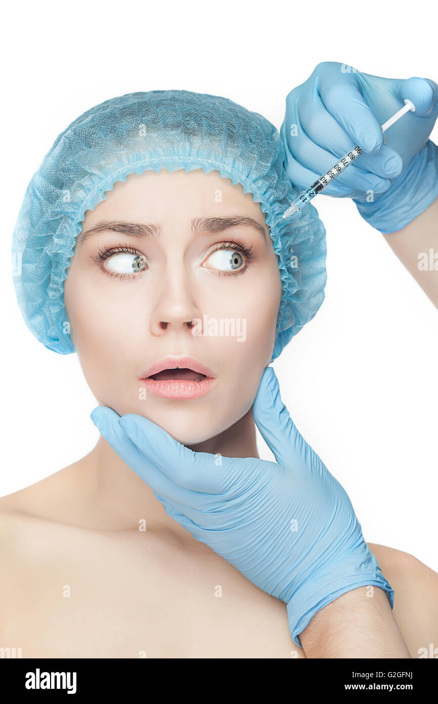 Attractive woman at plastic surgery with syringe in her face Stock ...