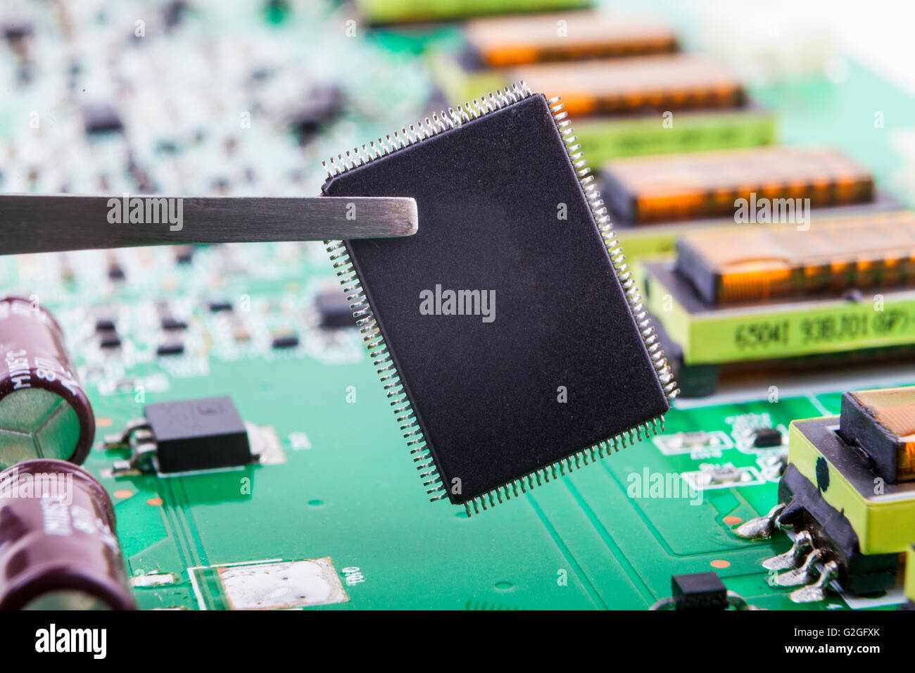 Micro Chip macro close-ip with circuit board in the background Stock ...