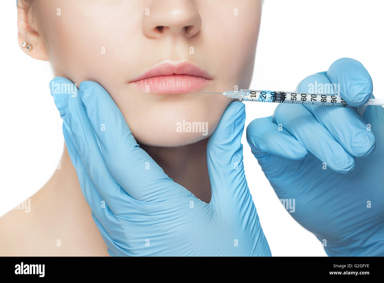 Attractive woman at plastic surgery with syringe in her face Stock ...
