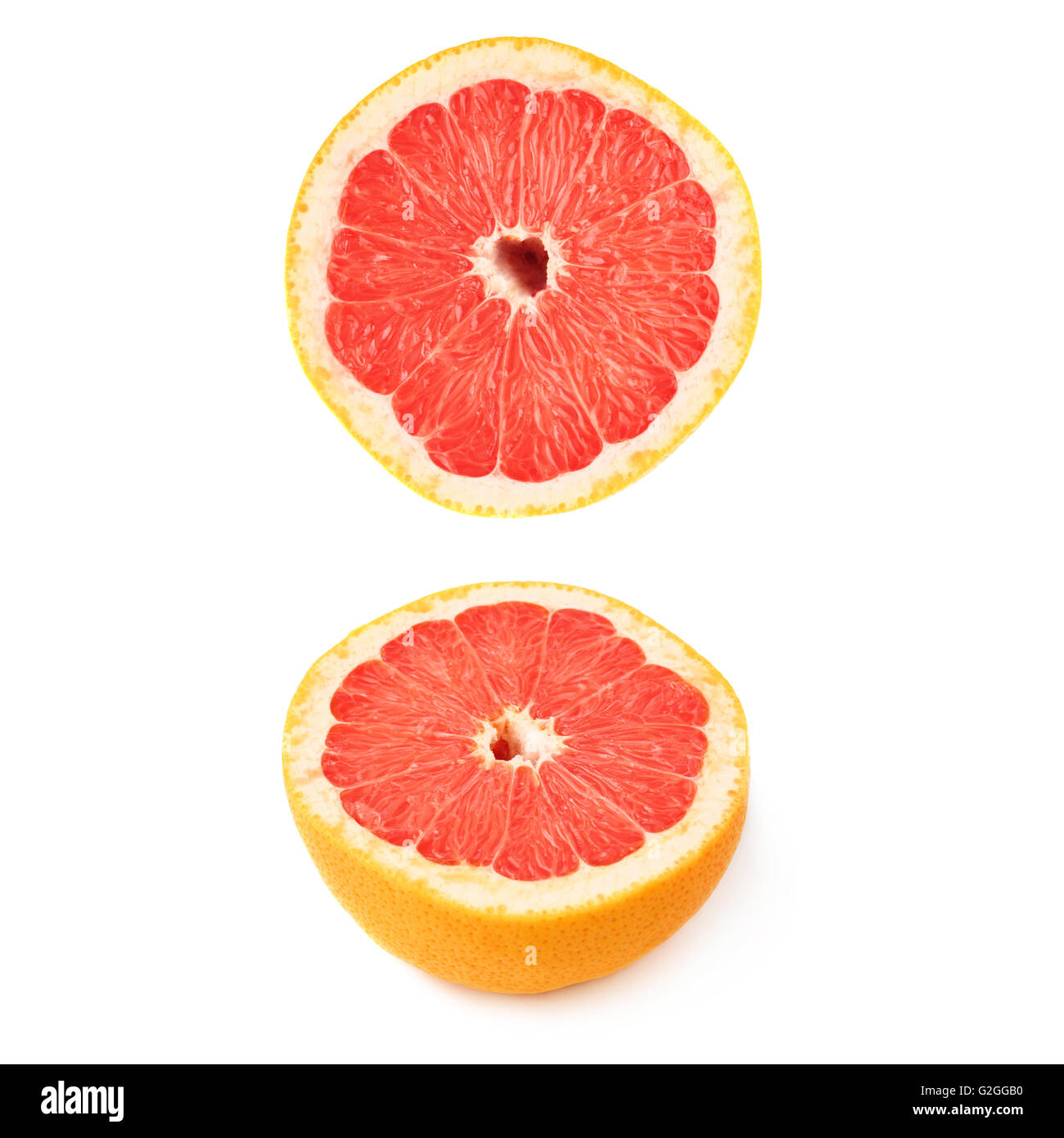 Single ripe grapefruit cut in half isolated over the white background ...