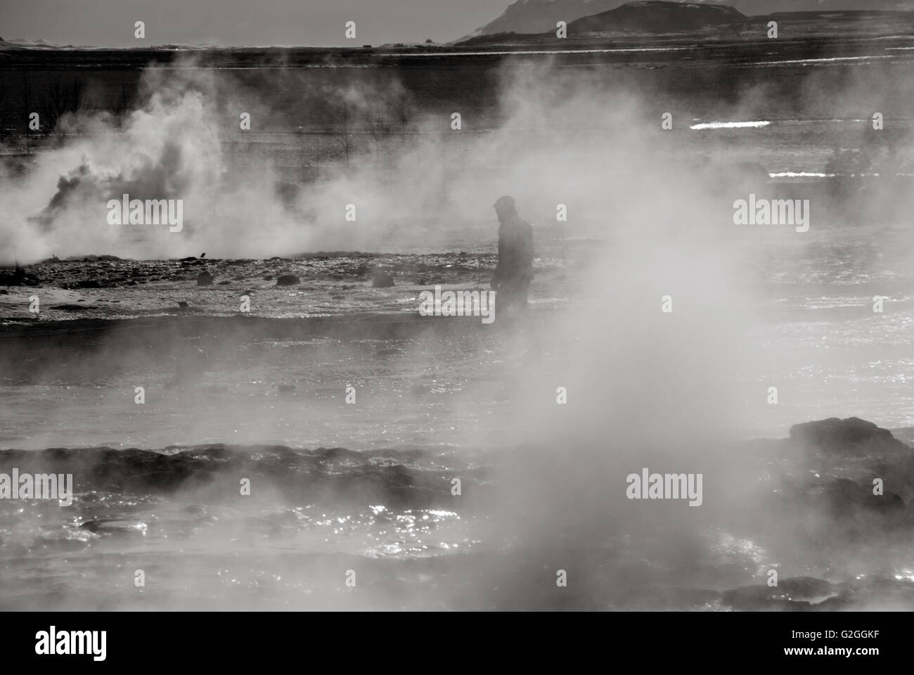 Young Adult Man Walking Through Steam from Geyser, Iceland Stock Photo ...