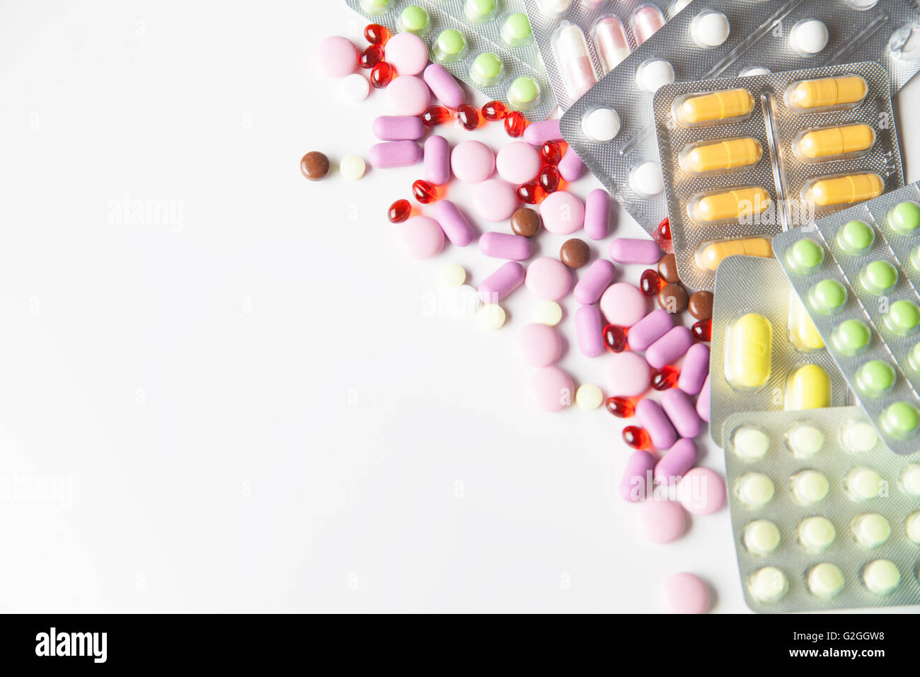Colorful tablets on white background Stock Photo - Alamy