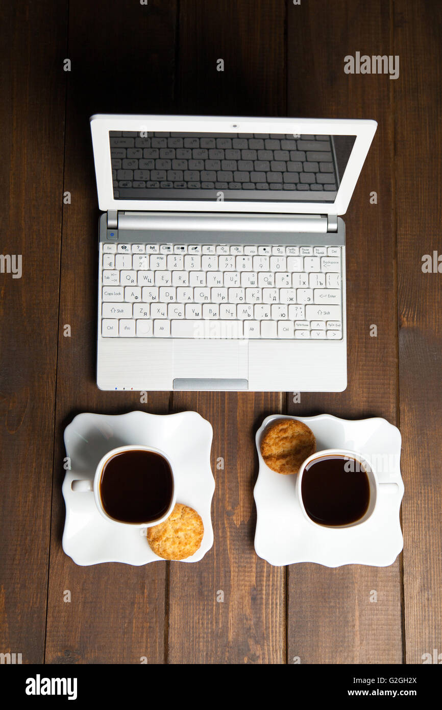Morning coffee for two and laptop Stock Photo - Alamy