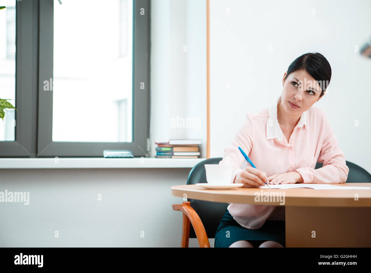 One woman writing paper light hi-res stock photography and images - Alamy