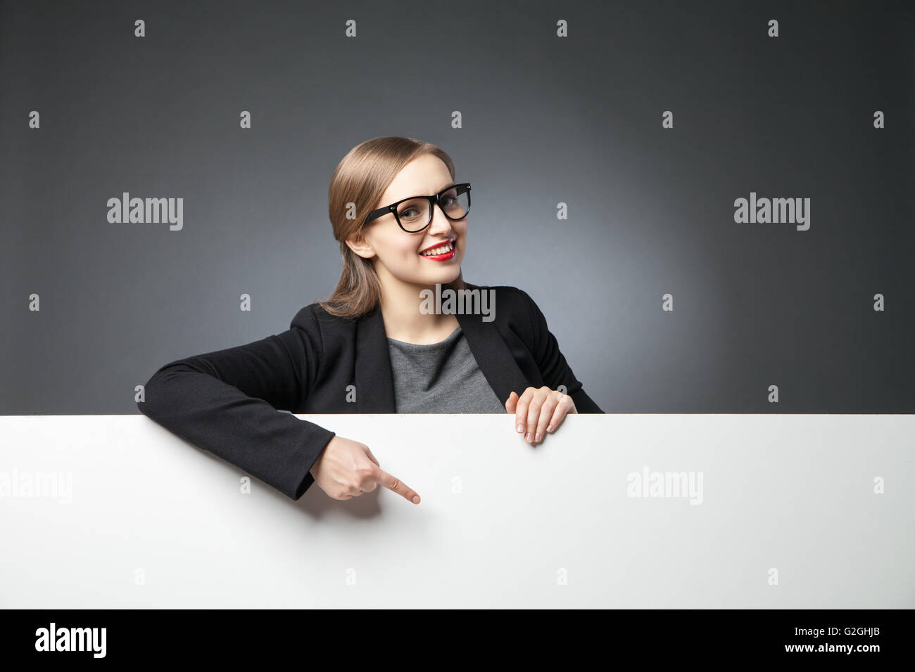 Woman pointing smile glasses hi-res stock photography and images - Alamy