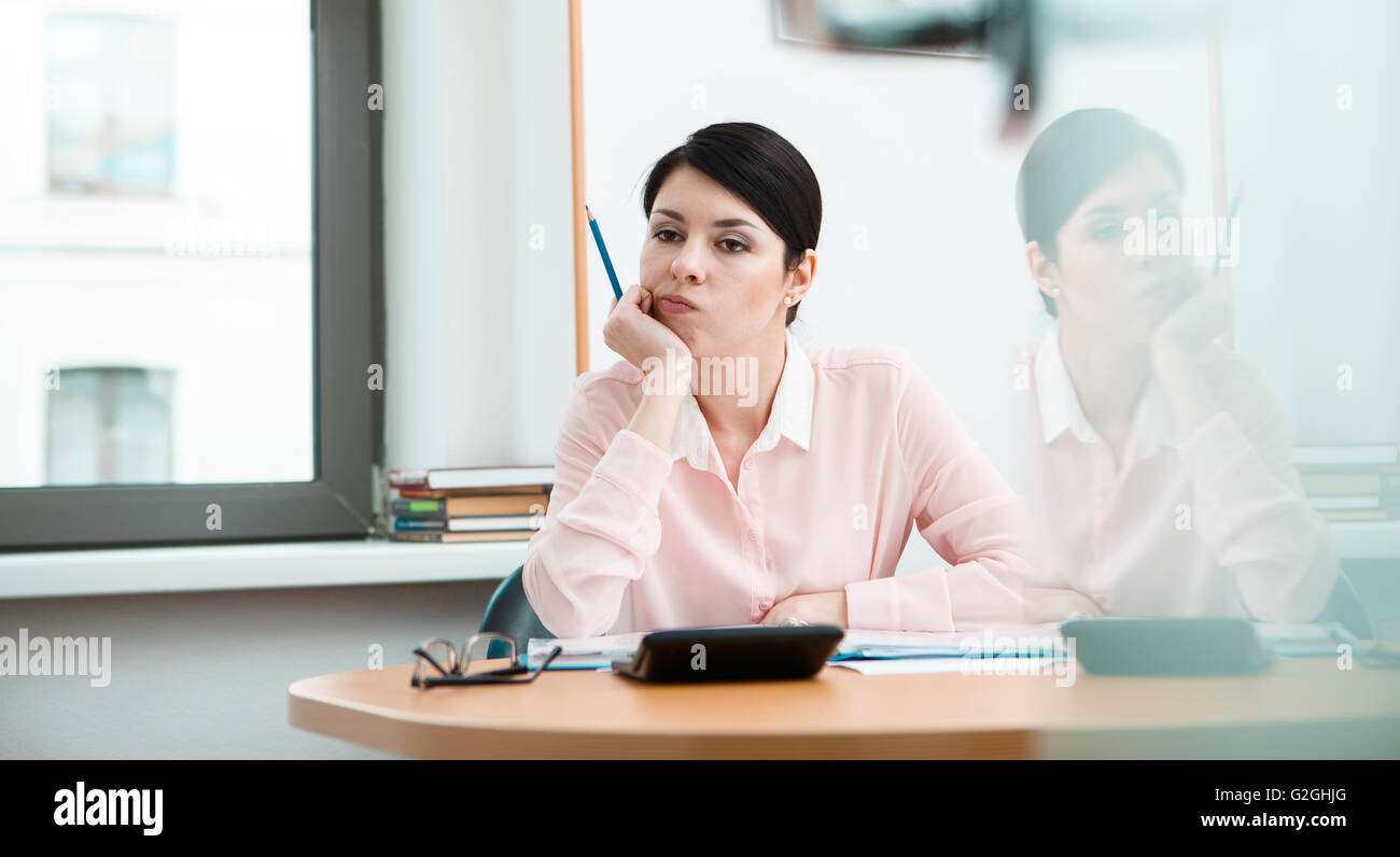Young office worker dreaming in her workplace Stock Photo - Alamy