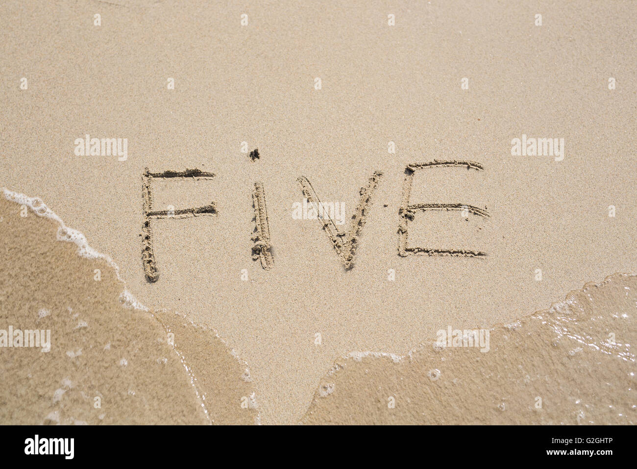 Number five. Sand Alphabet: digits. Concept holiday background Stock ...