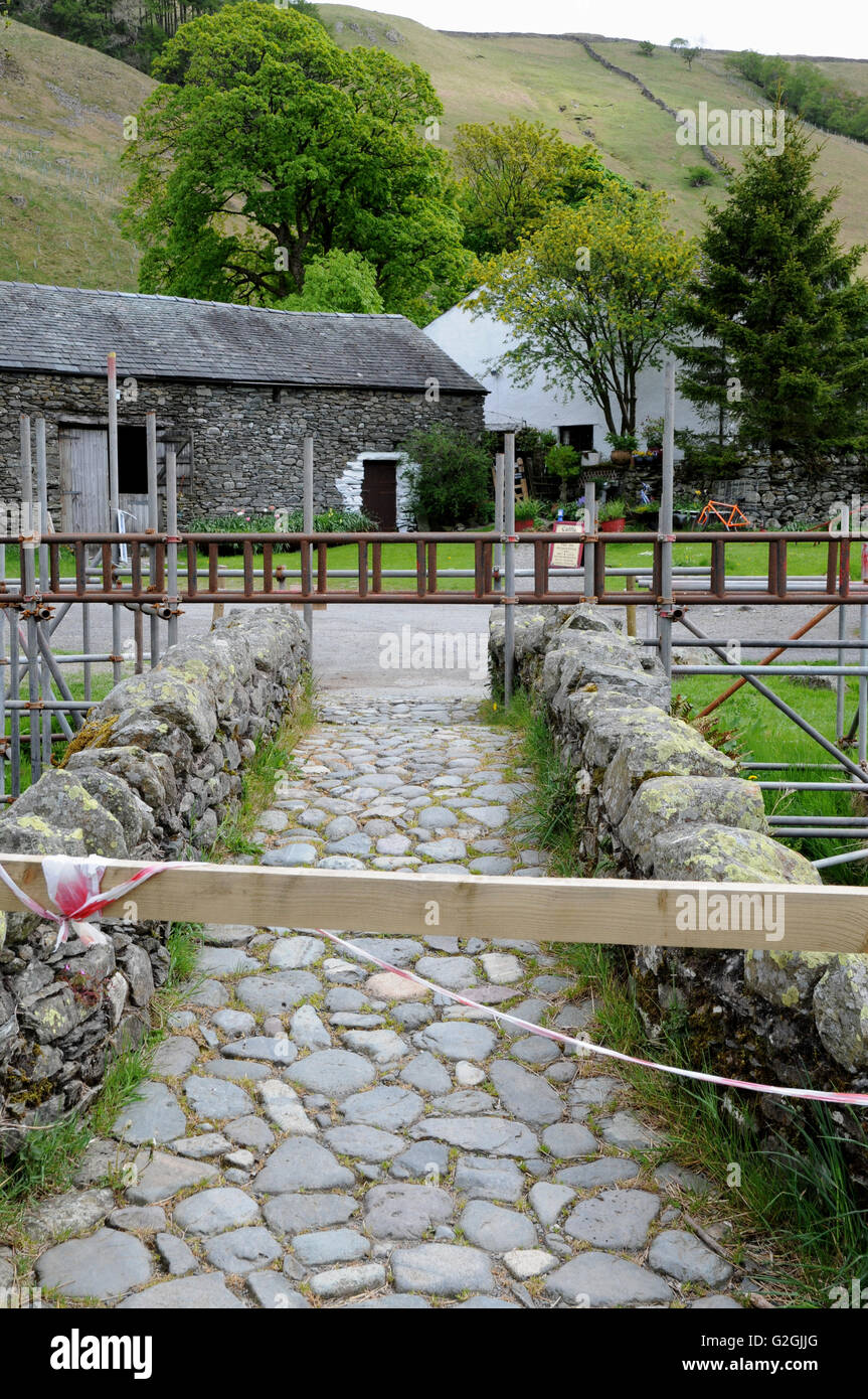 Repairs being made to the old Pack Horse Bridge at Watendlath in the ...