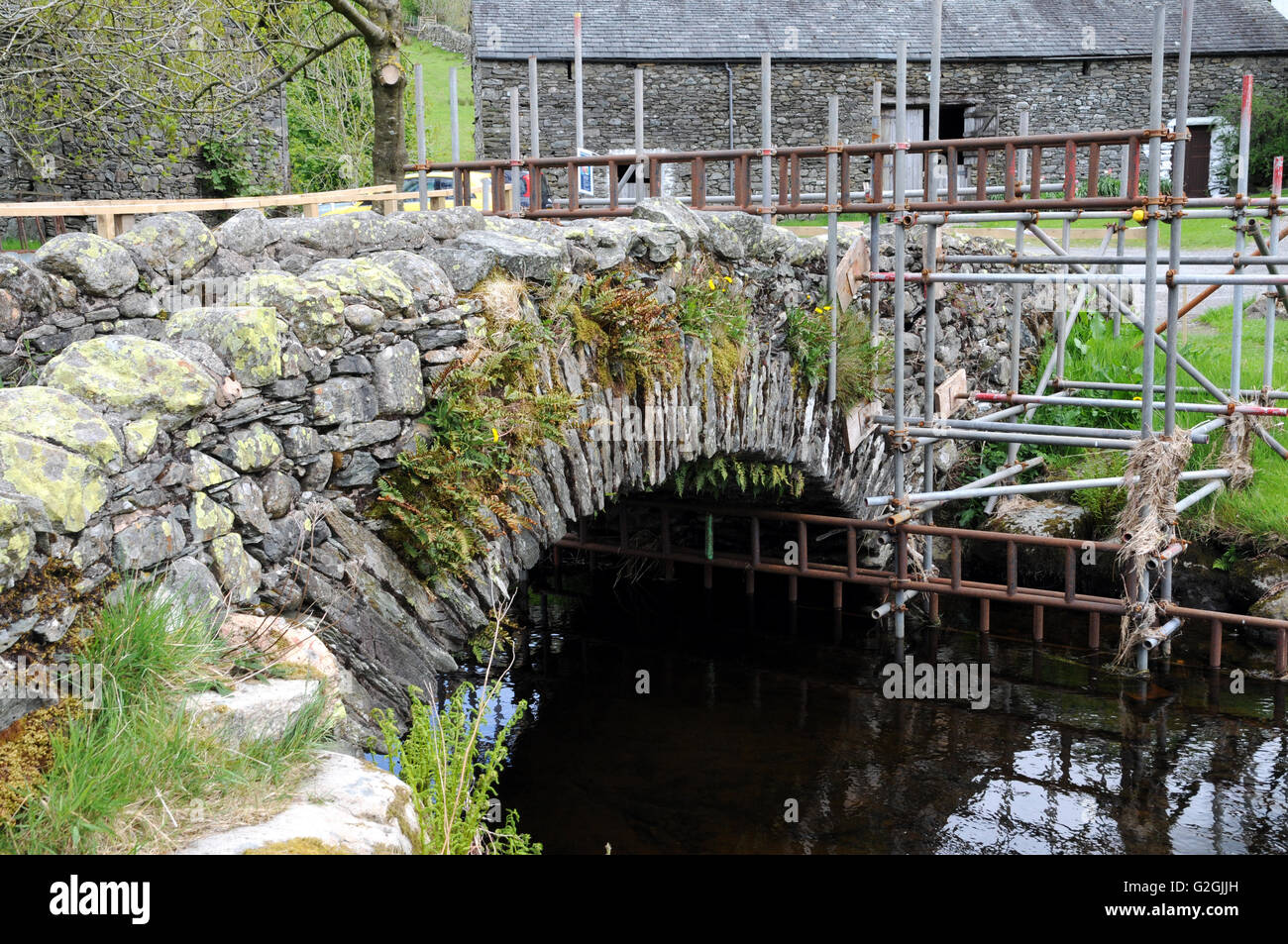 Repairs being made to the old Pack Horse Bridge at Watendlath in the ...