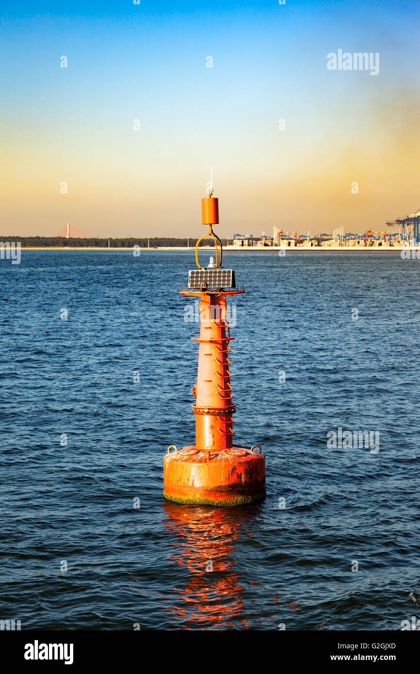Navigation red buoy at the edge of a fairway Stock Photo - Alamy