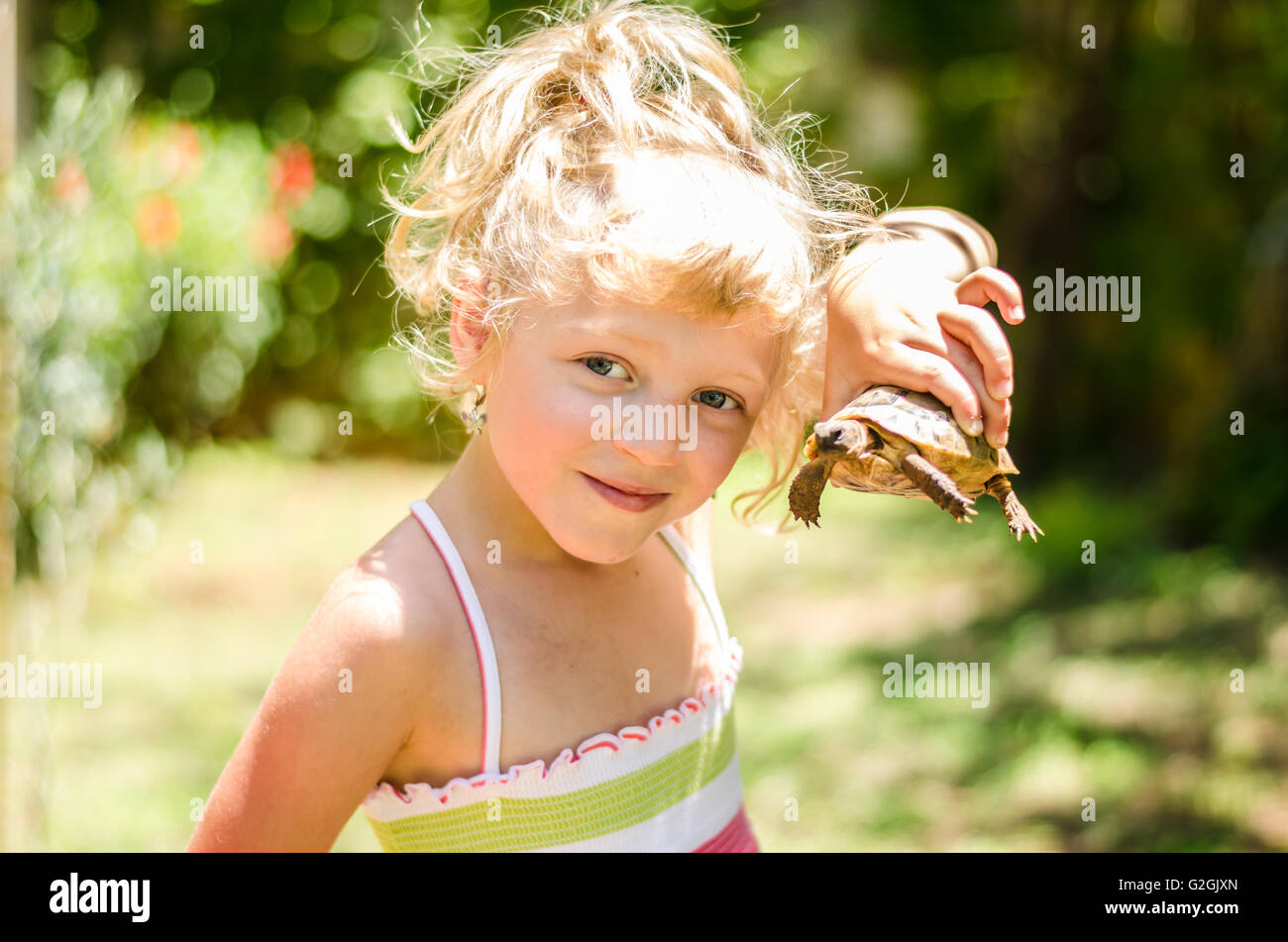 beautiful blond girl with turtle image Stock Photo - Alamy