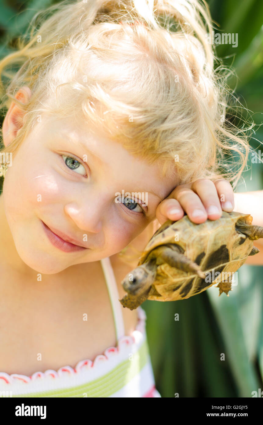 beautiful blond girl with turtle image Stock Photo - Alamy