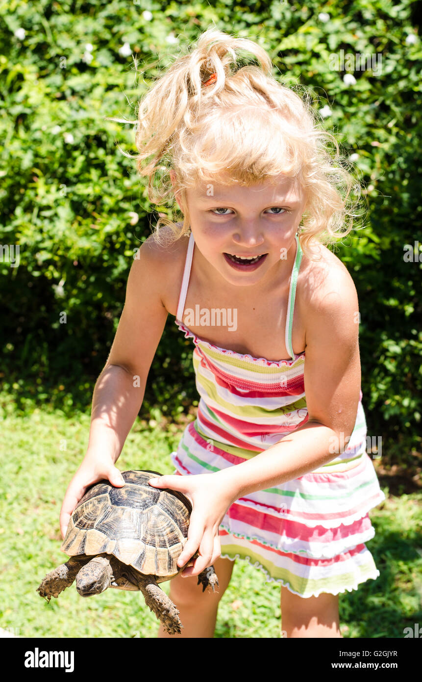 beautiful blond girl with turtle image Stock Photo - Alamy