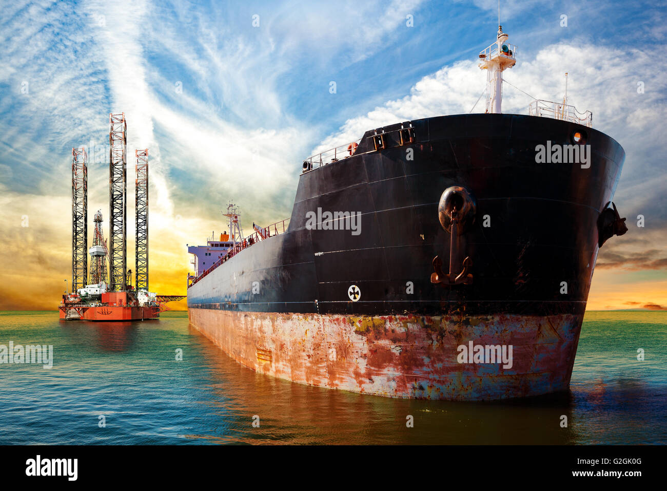 Tanker ship and Oil Platform on offshore area at sunset Stock Photo - Alamy