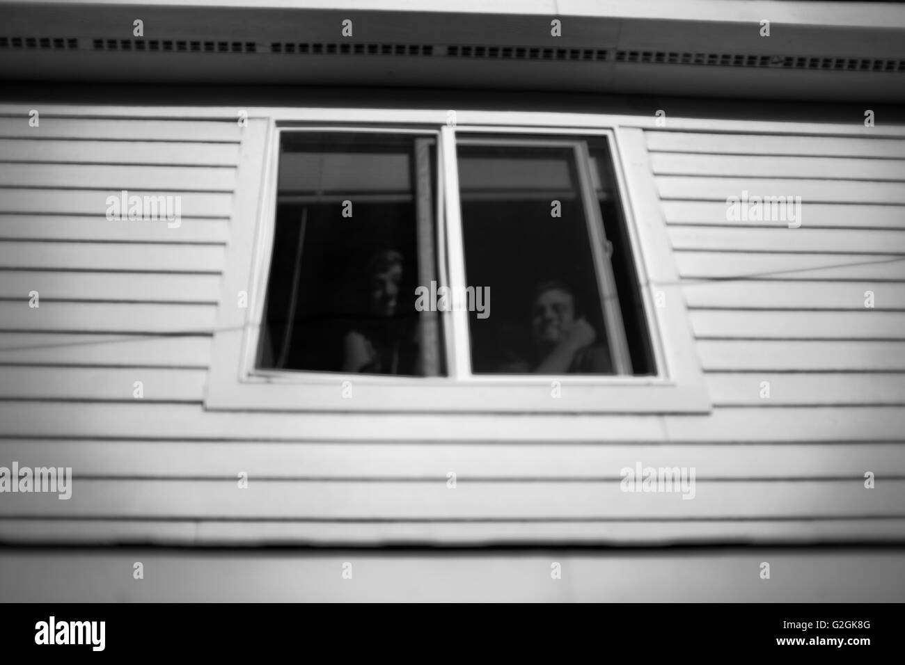 Two Young Men Looking out of Window, Low Angle View Stock Photo - Alamy