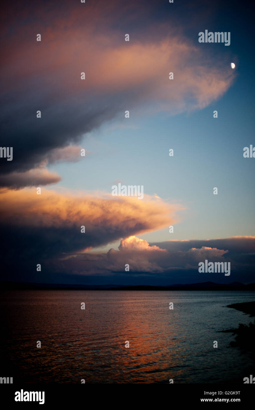 Dramatic Cloud Formation over Water at Sunset Stock Photo - Alamy