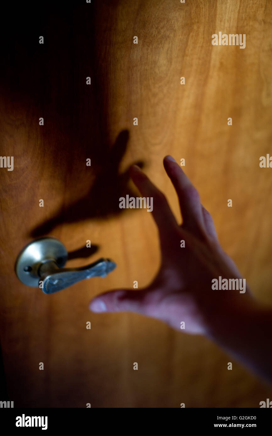 Hand Reaching for Door Handle Stock Photo - Alamy