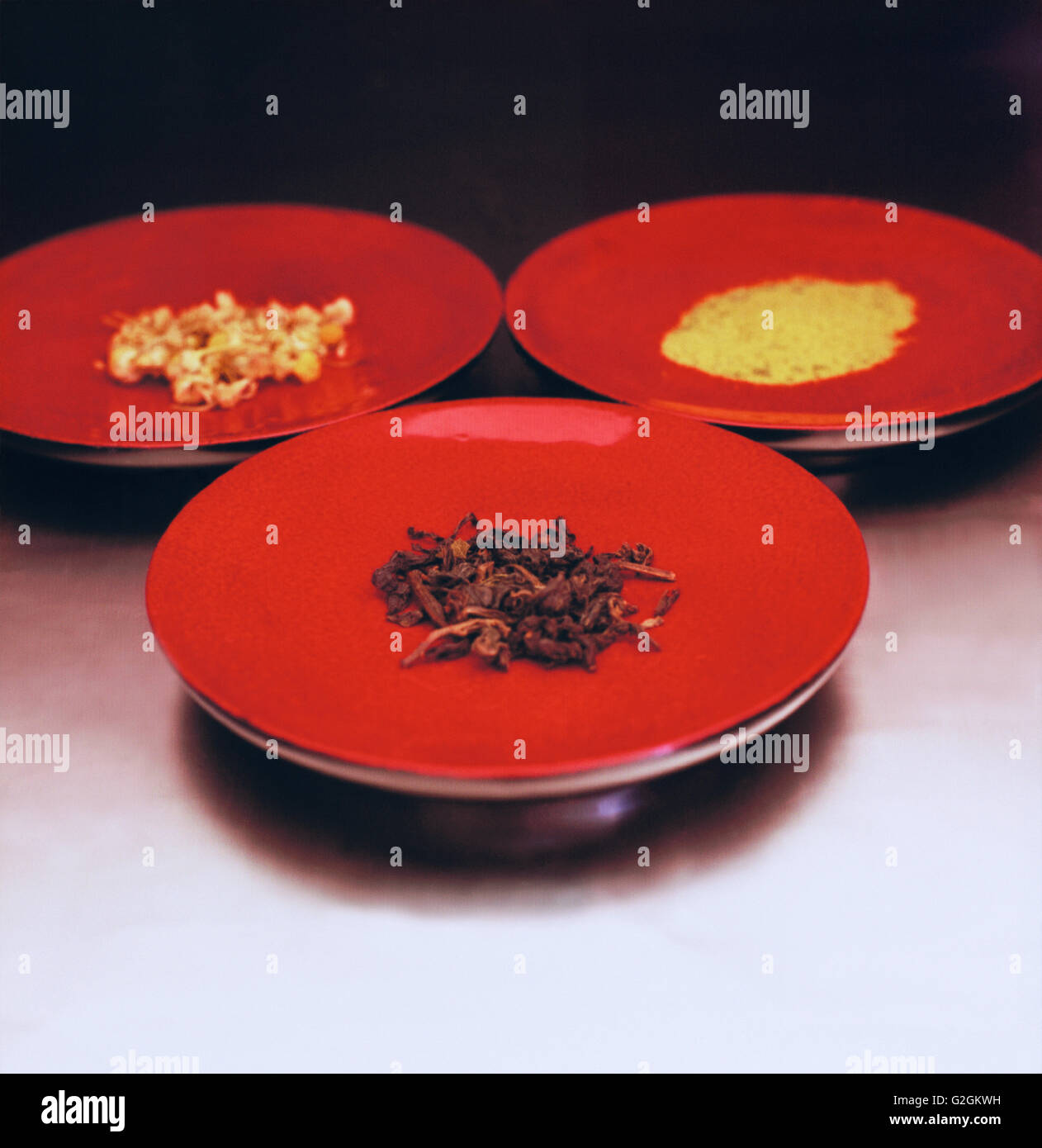 Tea Leaves on Red Plates Stock Photo - Alamy