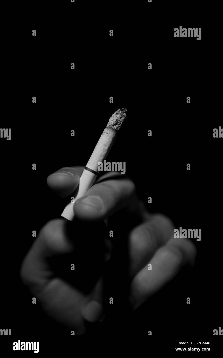 Hand with Cigarette Stock Photo - Alamy