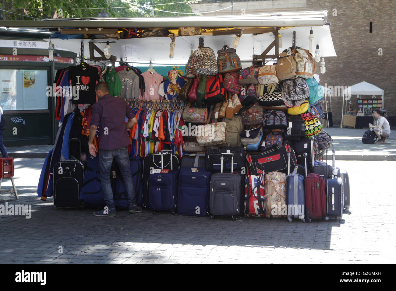 Seller of bags and T-shirts in Rome, Italy Stock Photo - Alamy